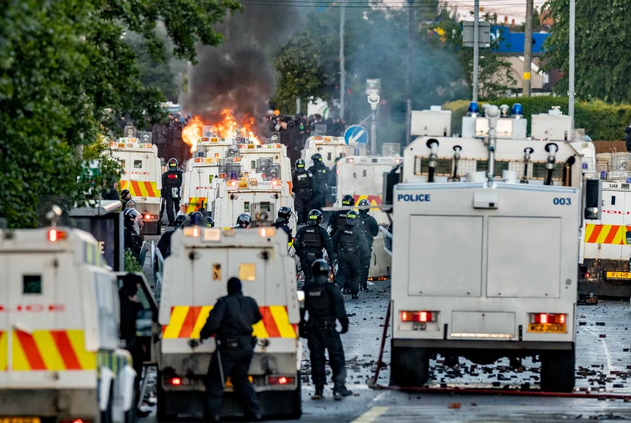 Belfast riots: Riot police turn water cannon on crowd near Chimney ...